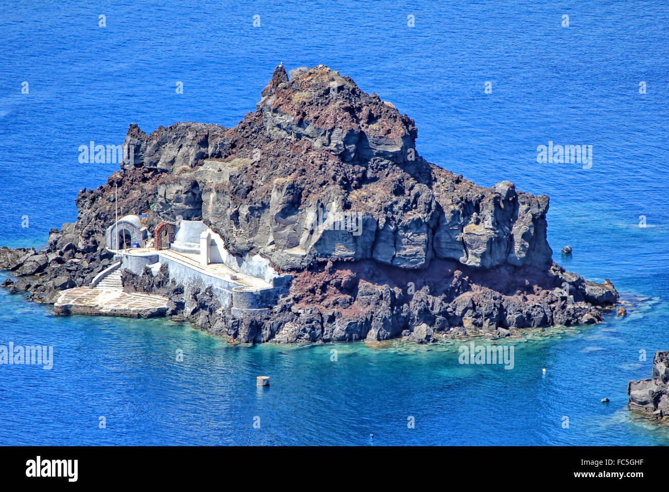 Volcanic rock in the sea Stock Photo - Alamy