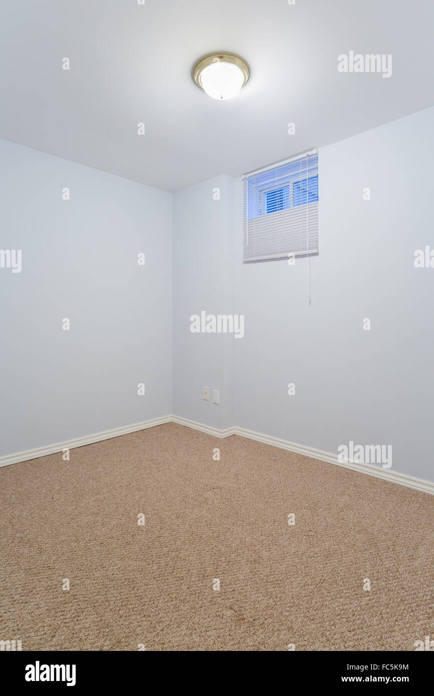 Empty basement bedroom interior design Stock Photo - Alamy