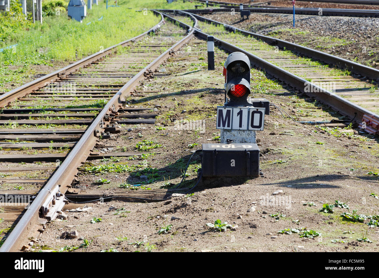 red light on railway track Stock Photo - Alamy
