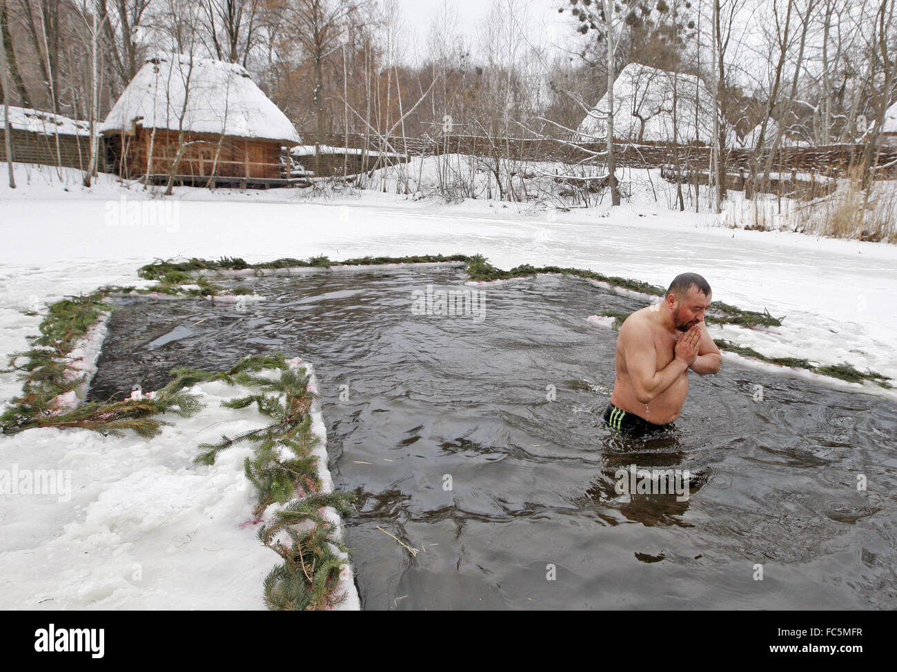 Kiev, Ukraine. 19th Jan, 2016. An Ukrainian Orthodox believer bathe in ...