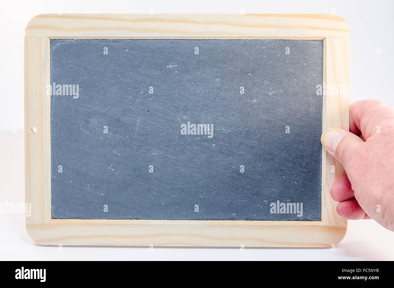 Hand holding a slate Stock Photo - Alamy