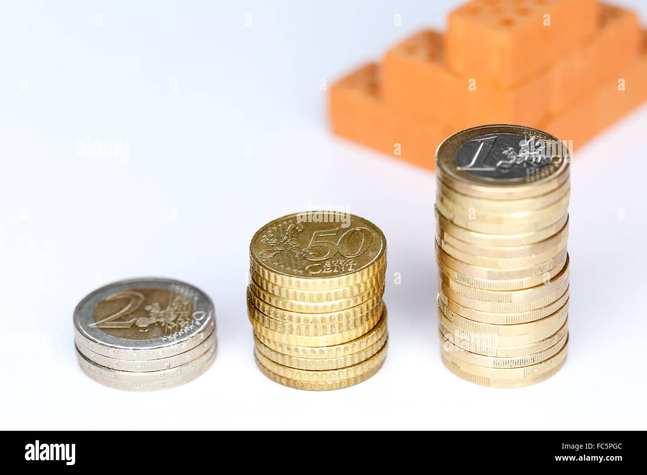 bricks and cash Stock Photo - Alamy