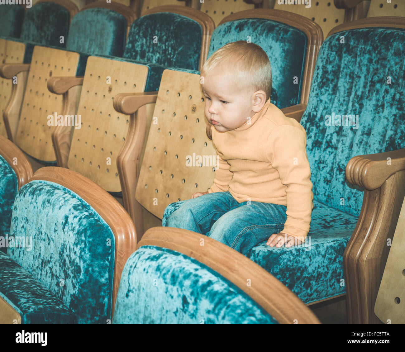 Boy in a theatre Stock Photo - Alamy