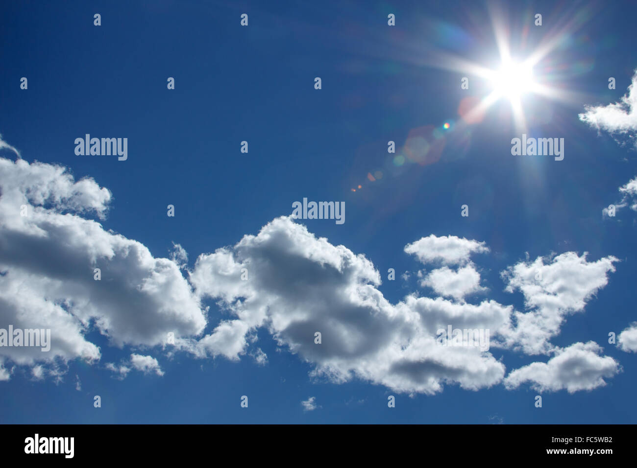 Sun in blue sky Stock Photo - Alamy