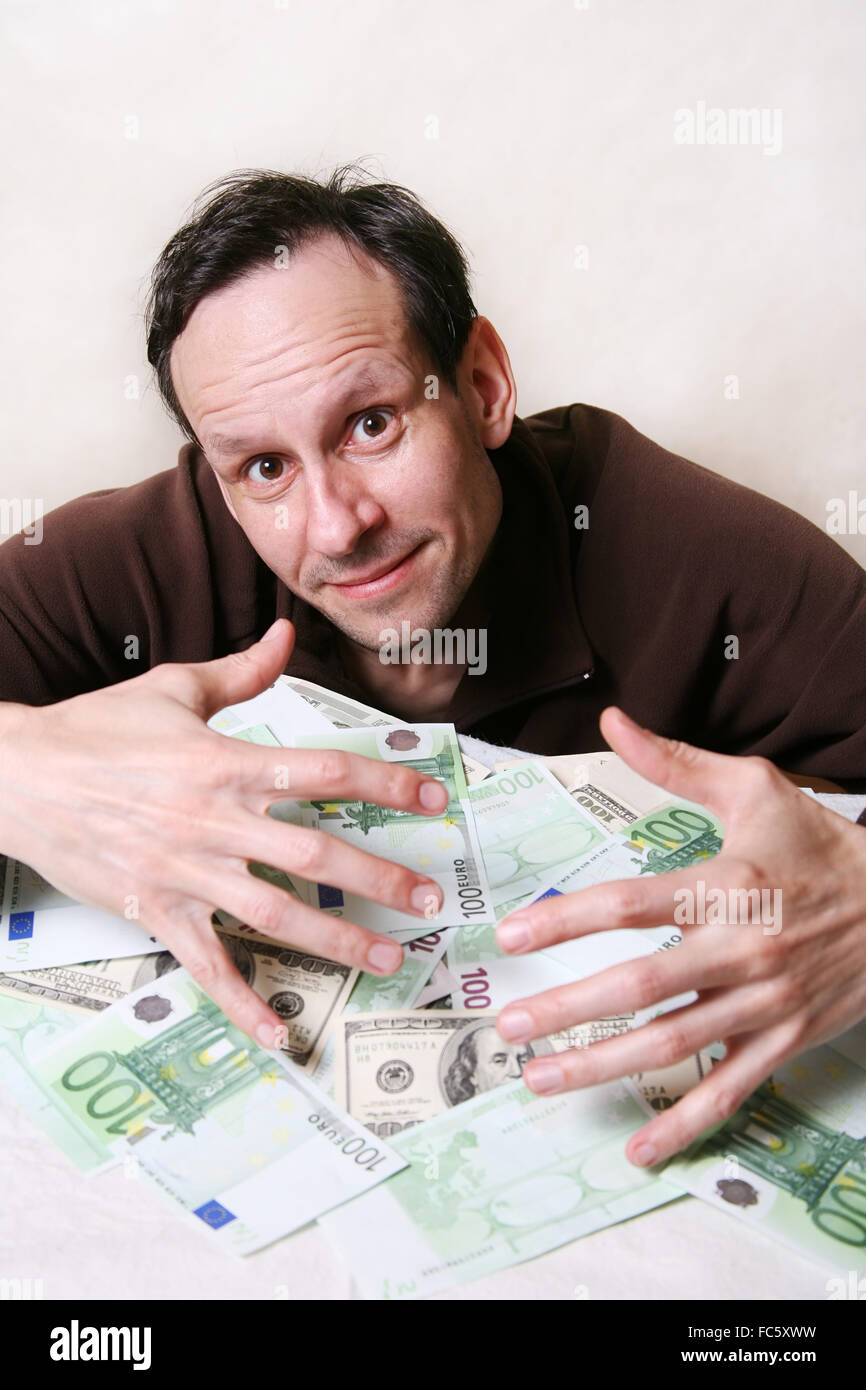 Heap of money Stock Photo - Alamy
