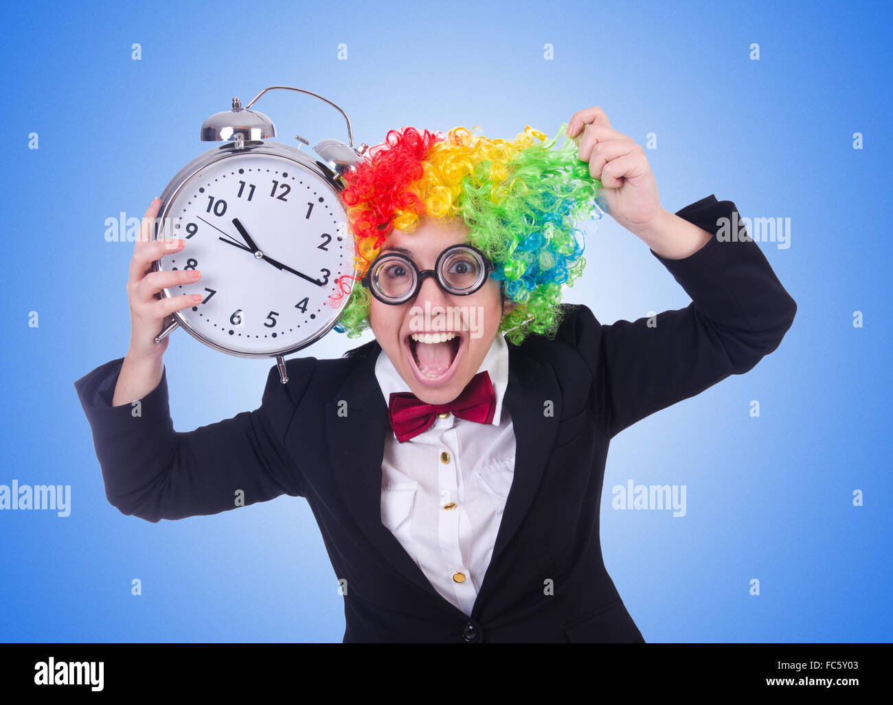 Funny clown with clock on white Stock Photo - Alamy