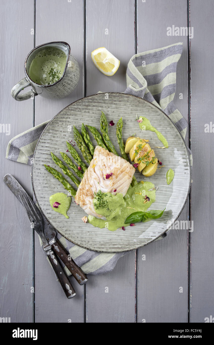 coal fish fillet with green asparagus Stock Photo - Alamy