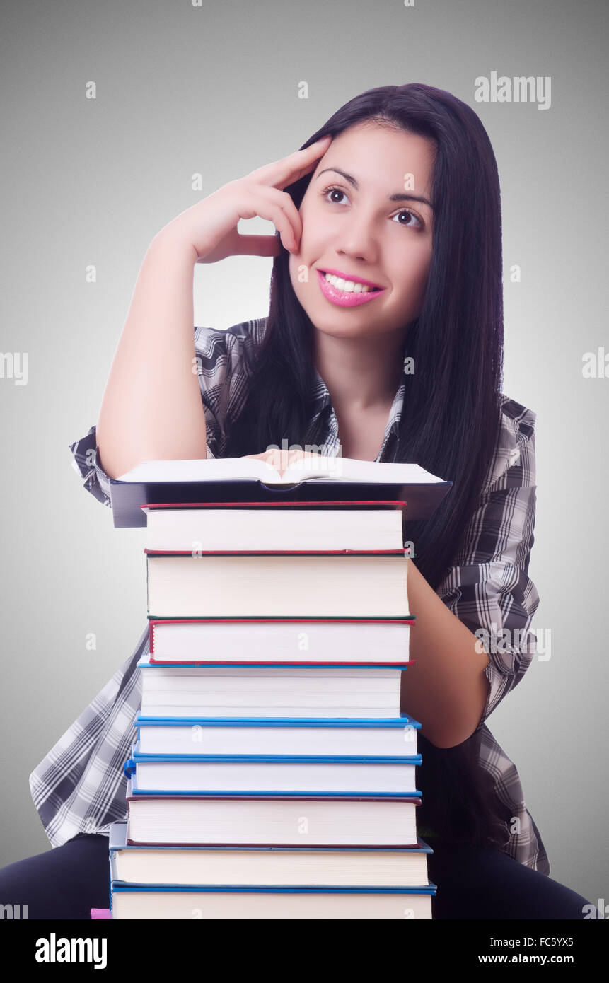 Girl student with books on white Stock Photo - Alamy