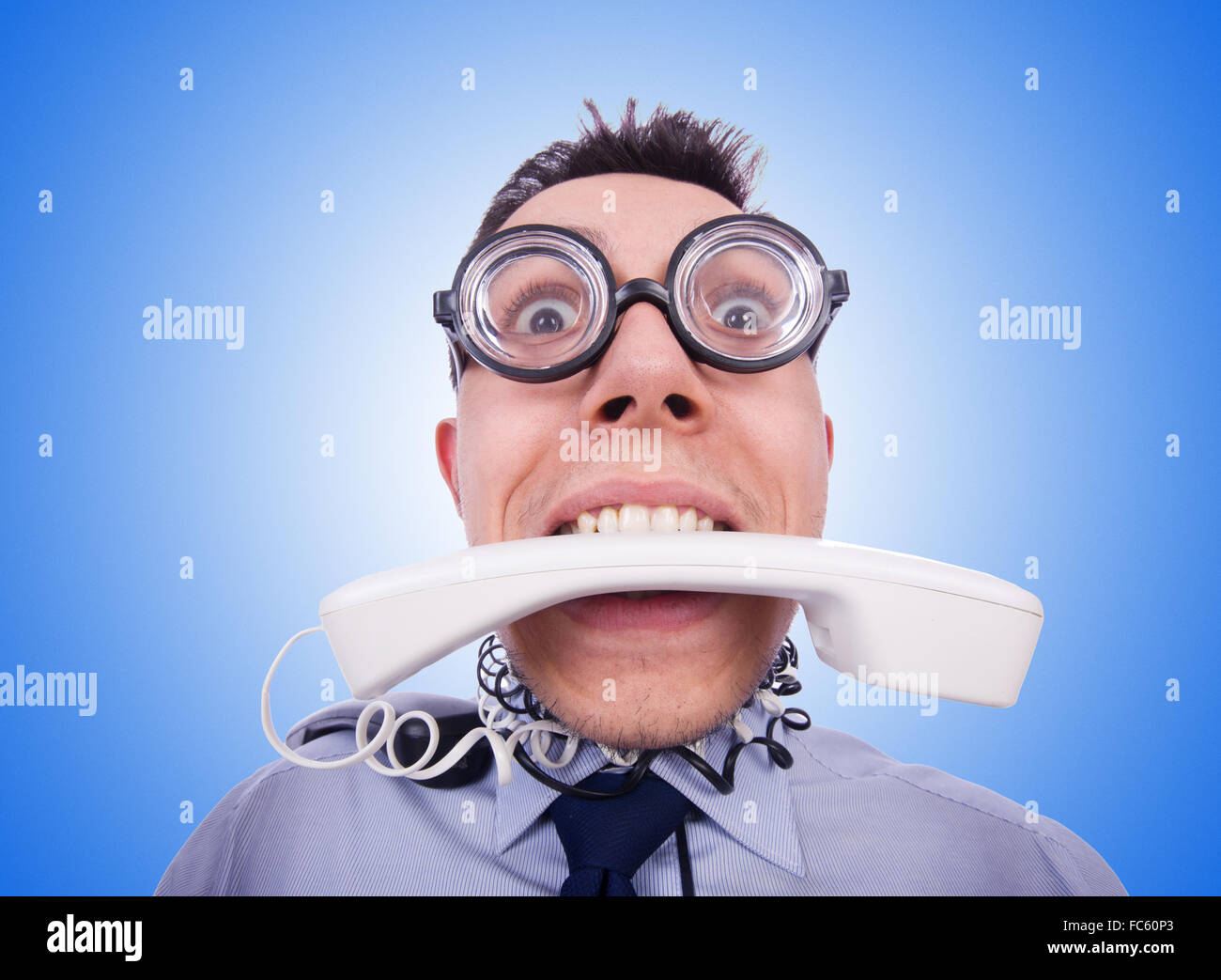 Crazy man with phone on white Stock Photo - Alamy