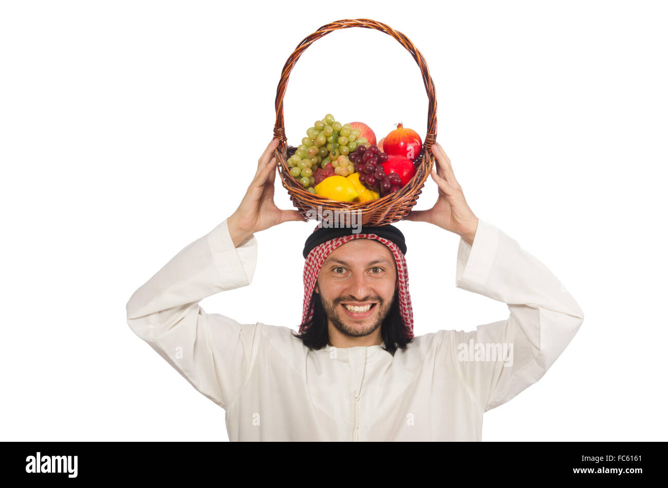 Arab man with fruits isolated on white Stock Photo - Alamy