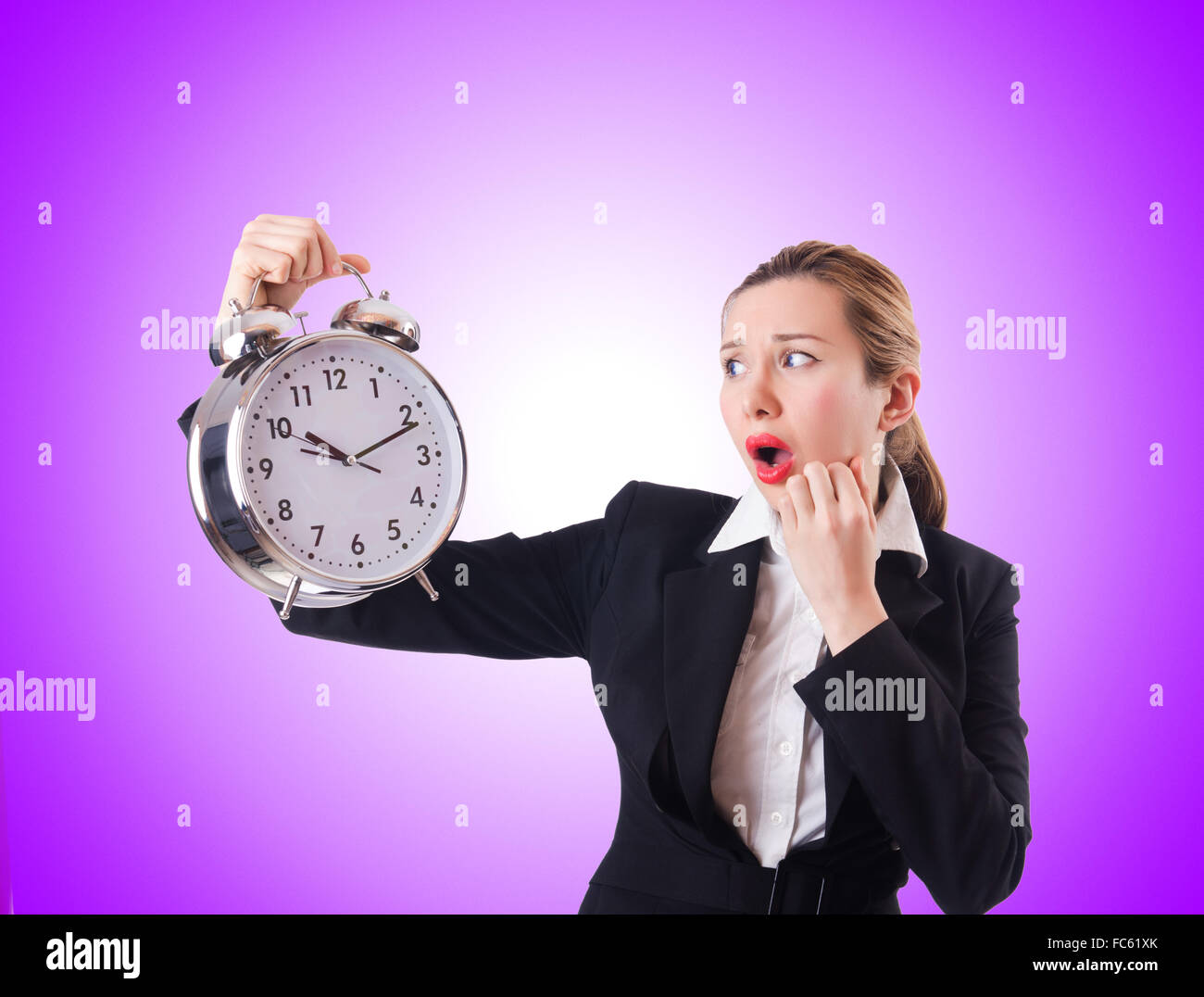 Woman businesswoman with giant clock Stock Photo - Alamy