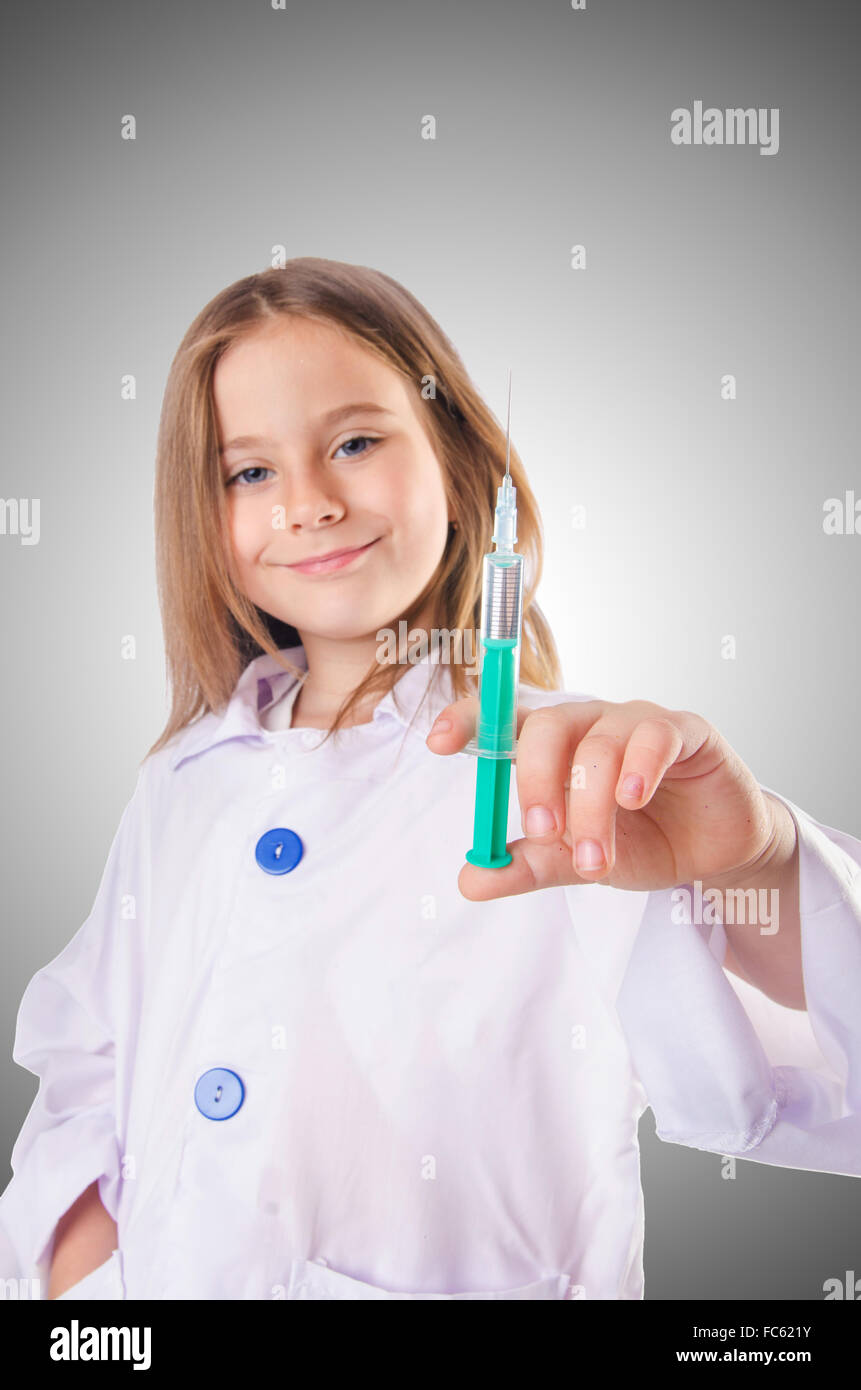 Little doctor with syringe Stock Photo - Alamy