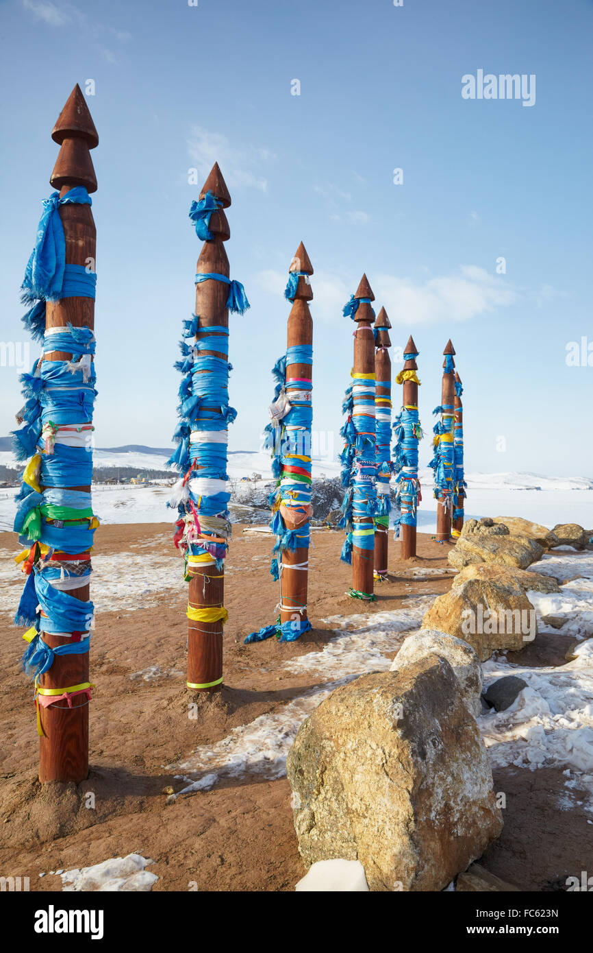 Wooden shaman totems with ribbons Stock Photo - Alamy