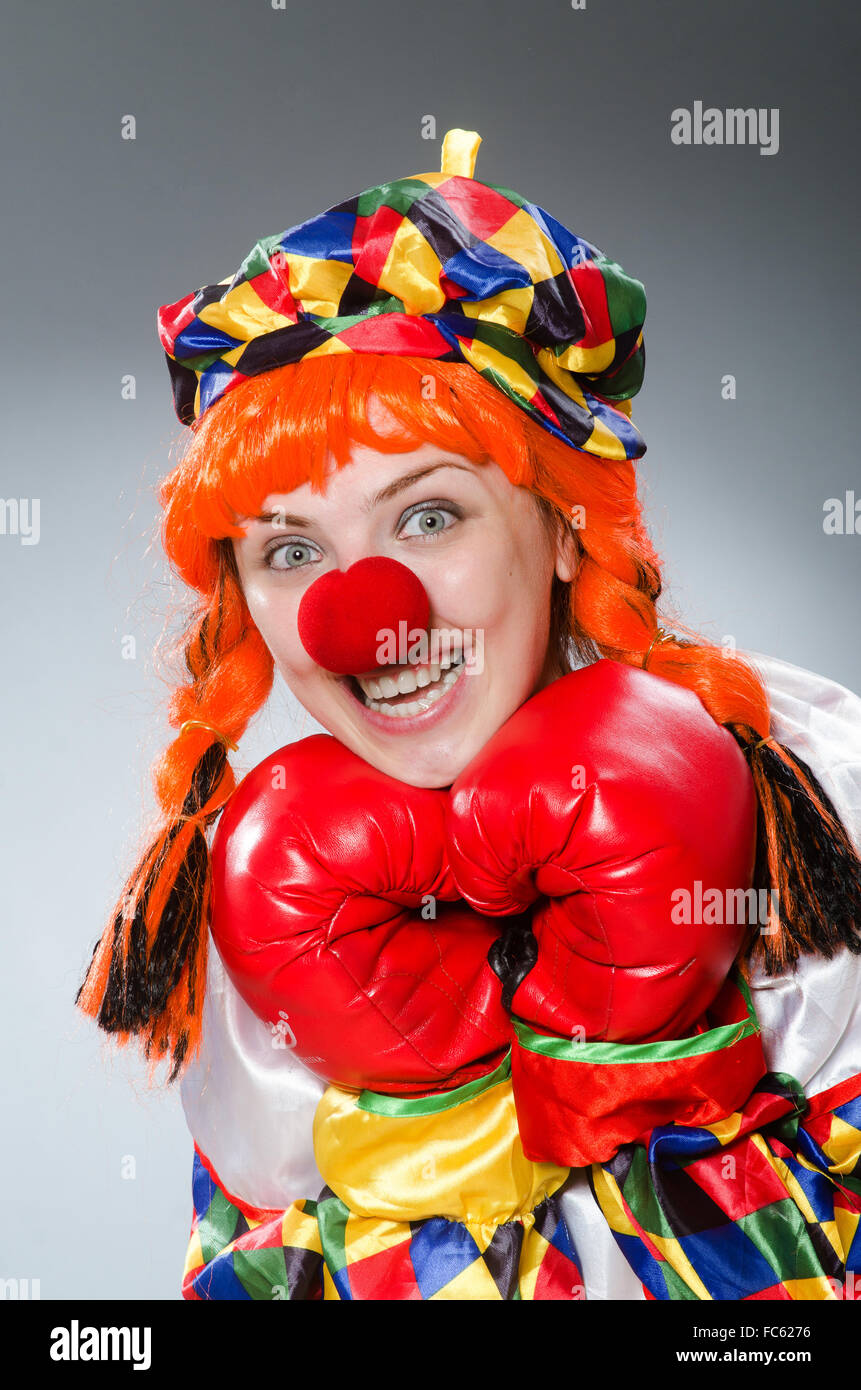 Clown with boxing gloves isolated on white Stock Photo - Alamy