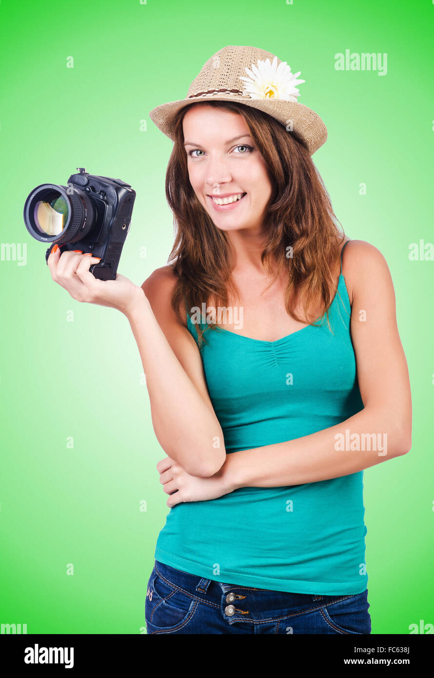 Attractive female photographer on white Stock Photo - Alamy