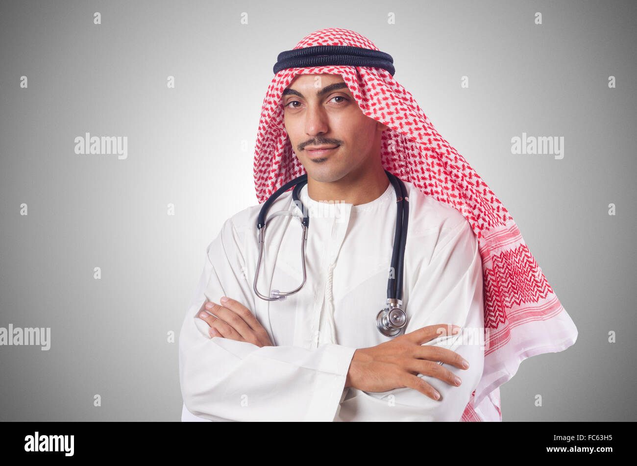Arab doctor with stethoscope on white Stock Photo - Alamy