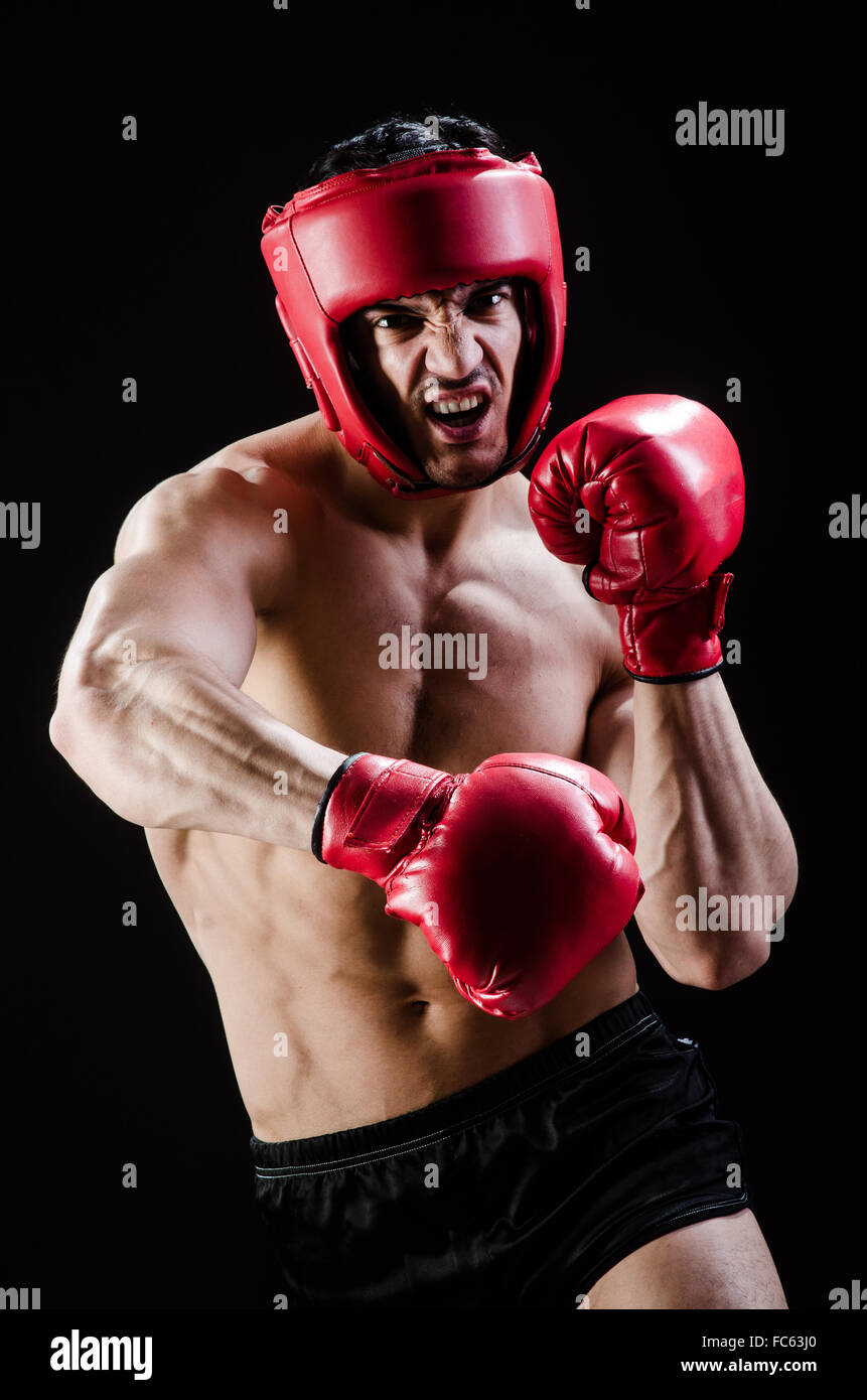 Muscular man in boxing concept Stock Photo - Alamy