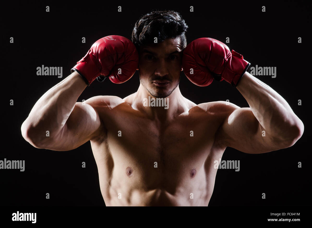 Muscular man in boxing concept Stock Photo - Alamy