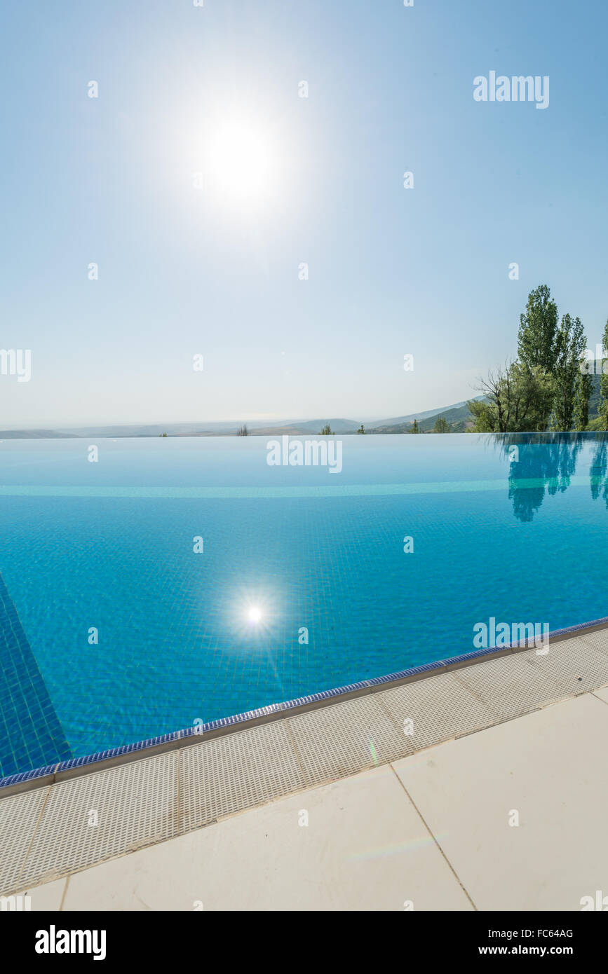 Infinity pool on the bright summer day Stock Photo - Alamy