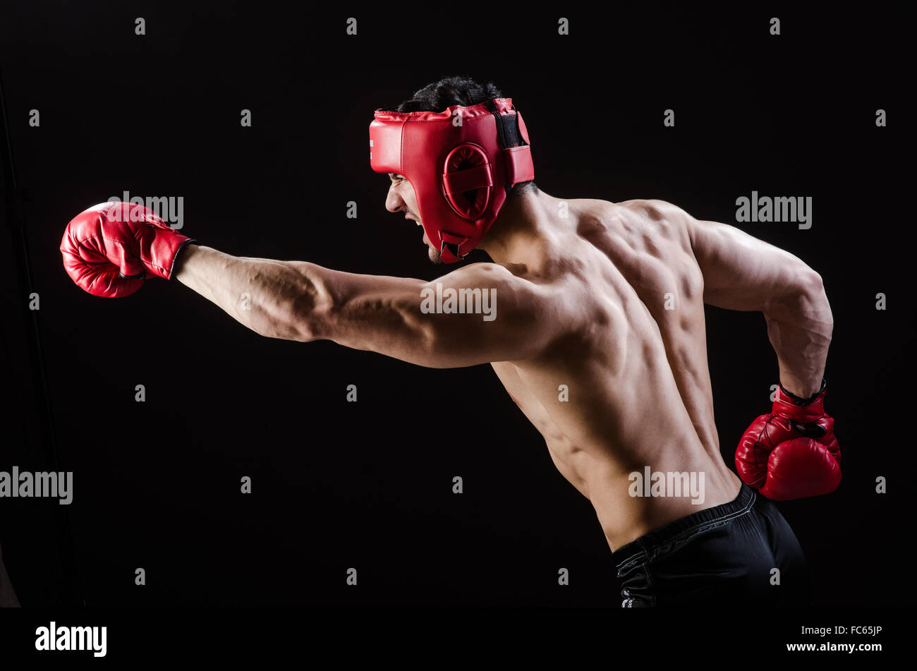 Muscular man in boxing concept Stock Photo - Alamy