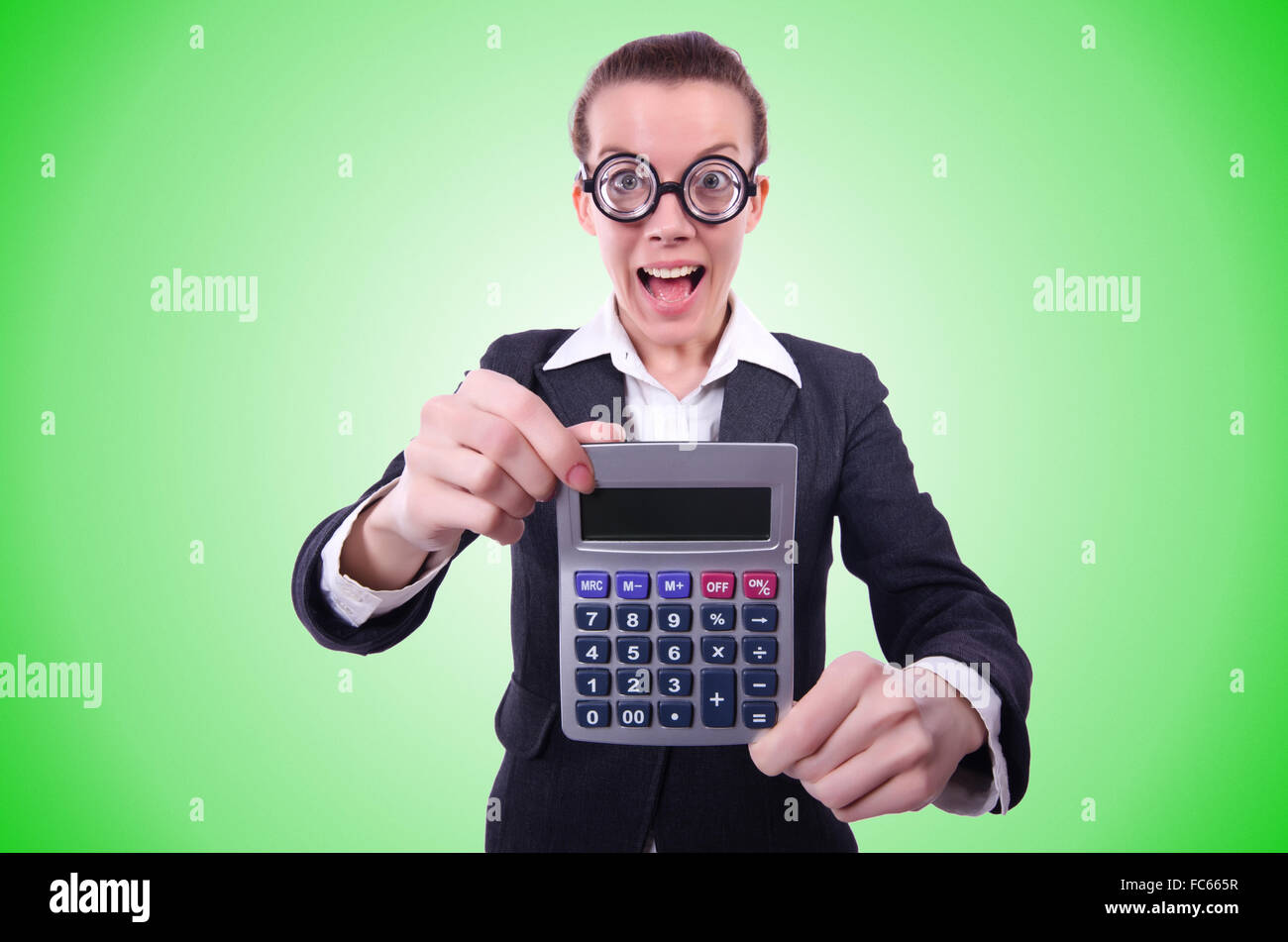Nerd female accountant with calculator Stock Photo - Alamy