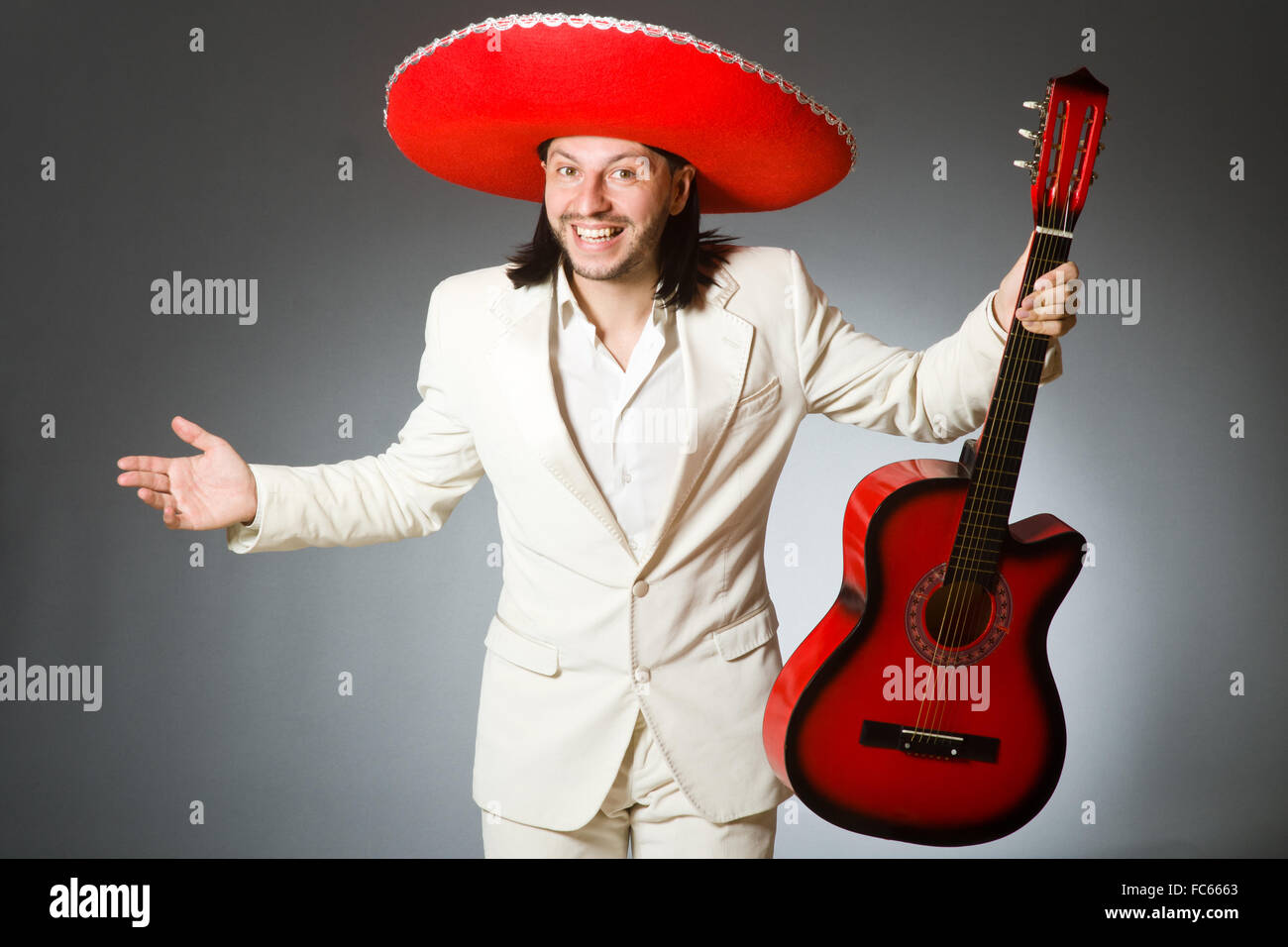 Young mexican guitar player wearing sombrero Stock Photo - Alamy