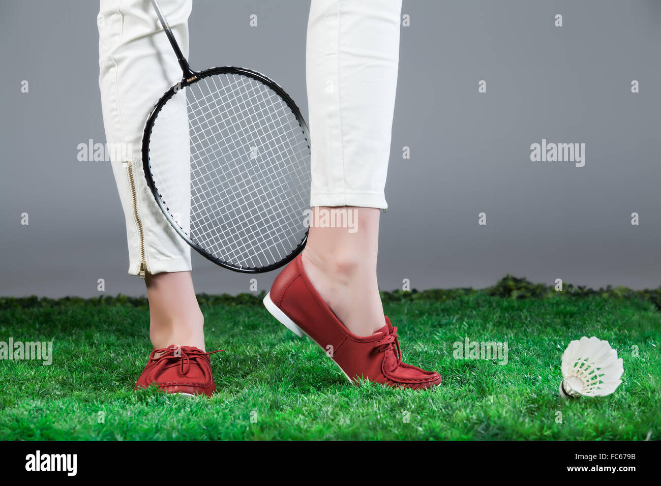 Woman's Legs And Badminton Racket Stock Photo - Alamy