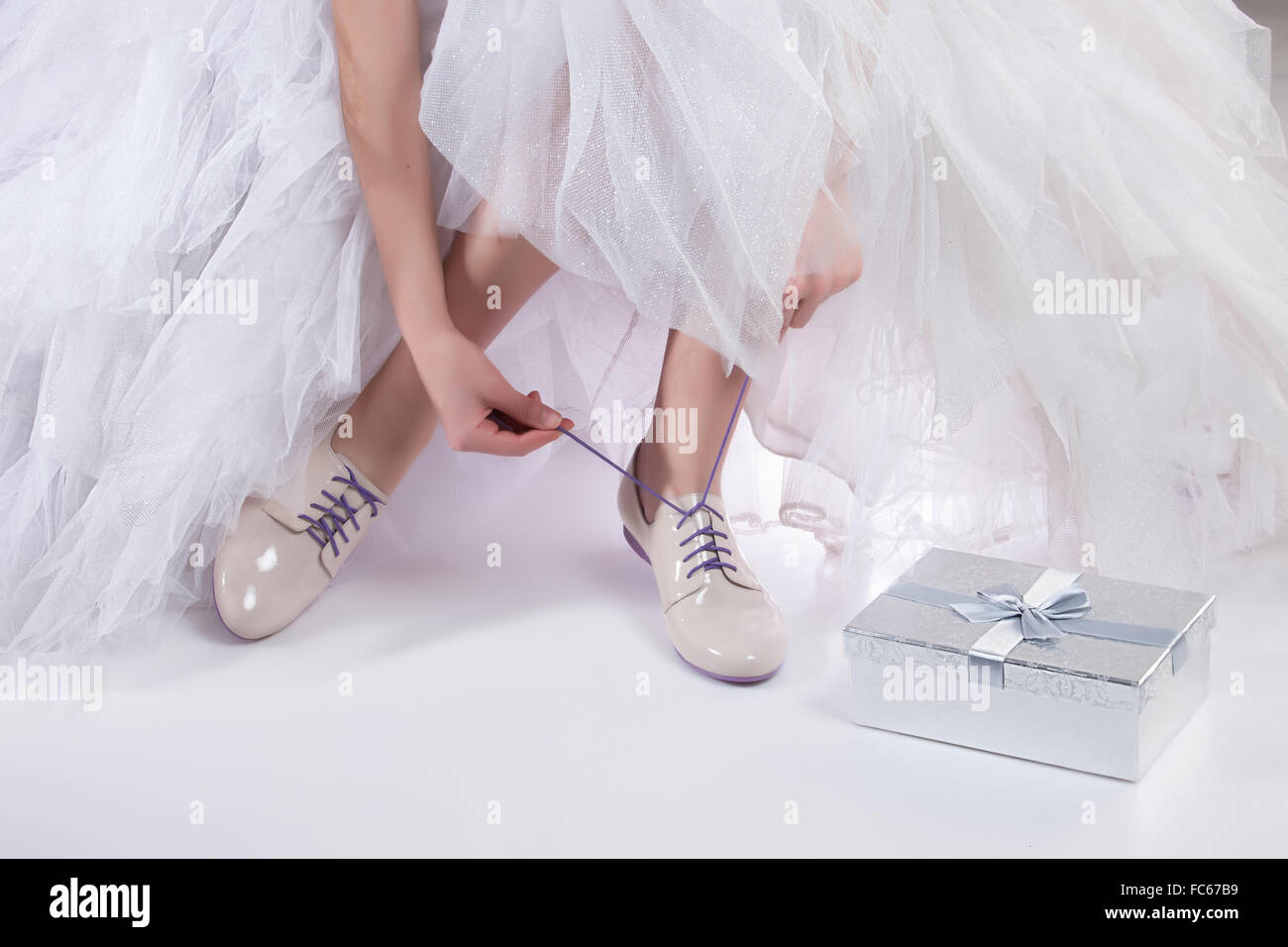 Woman's Legs And Wedding Dress Stock Photo - Alamy