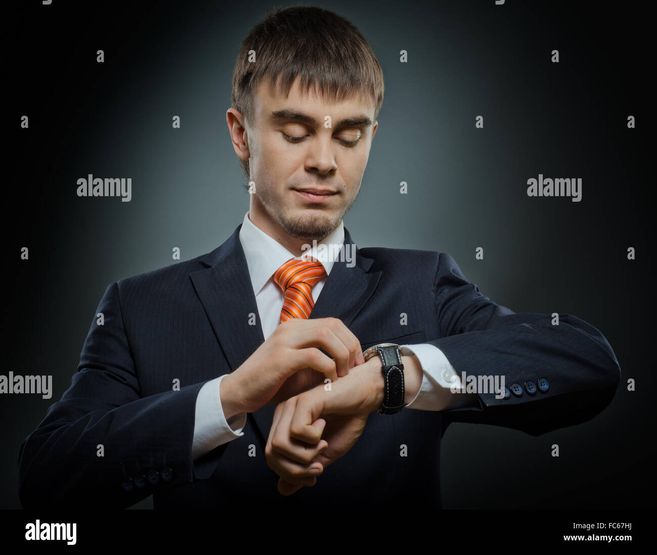 Man winding up watch hi-res stock photography and images - Alamy