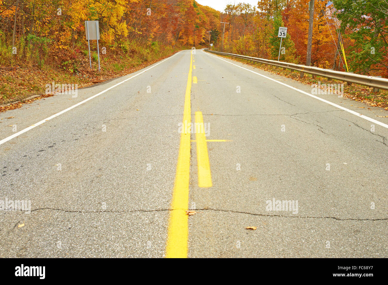 Autumn scene with road Stock Photo - Alamy