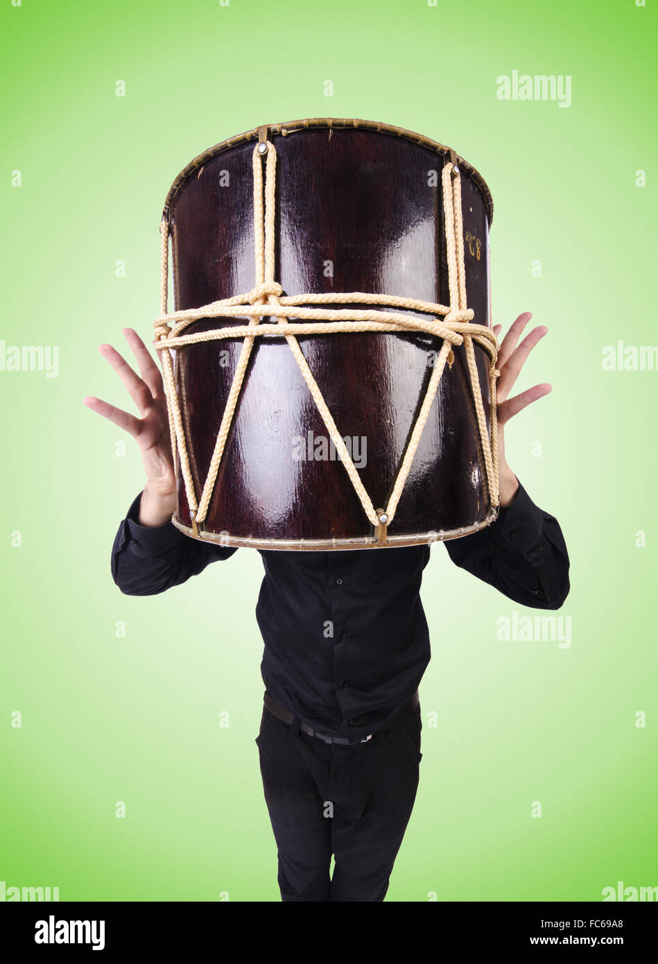 Funny man with drum on white Stock Photo - Alamy