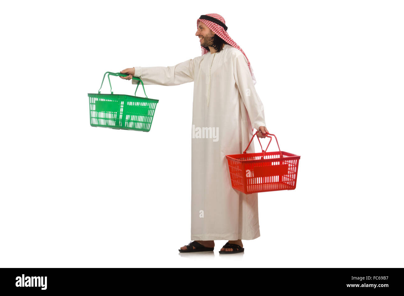 Arab man doing shopping isolated on white Stock Photo - Alamy