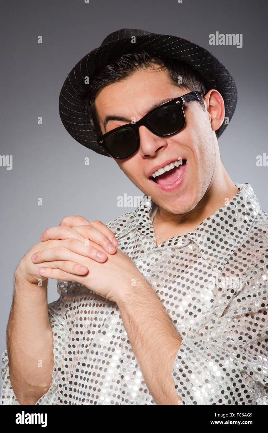 Young man in silver shirt and hat isolated on white Stock Photo - Alamy