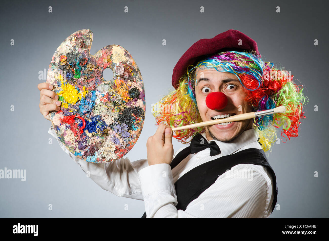 Funny artist in dark studio Stock Photo - Alamy