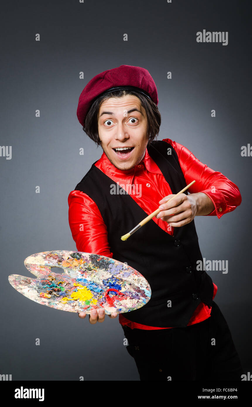 Funny artist in dark studio Stock Photo - Alamy