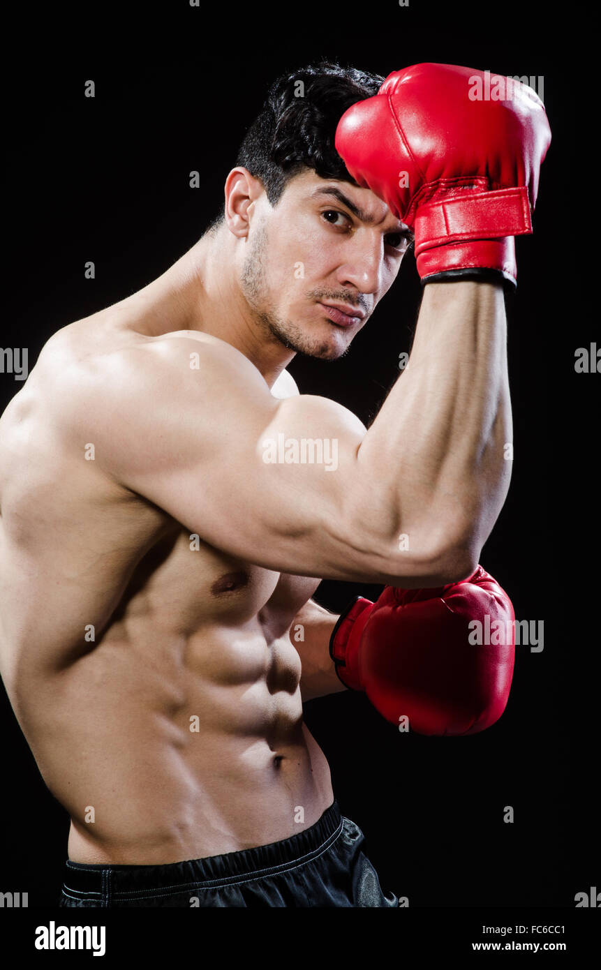 Muscular man in boxing concept Stock Photo - Alamy