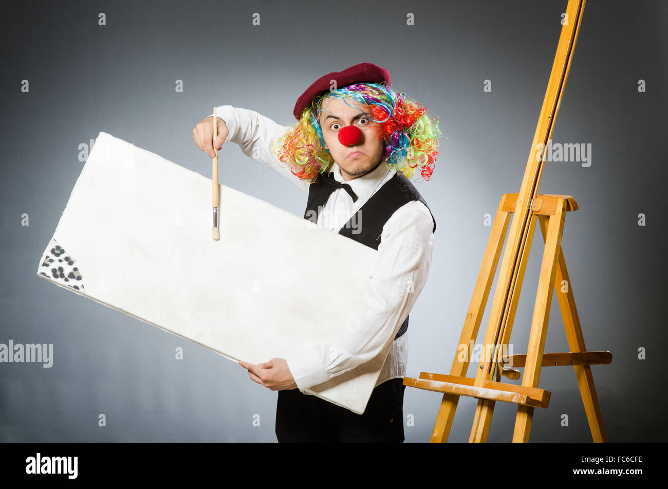 Funny artist in dark studio Stock Photo - Alamy