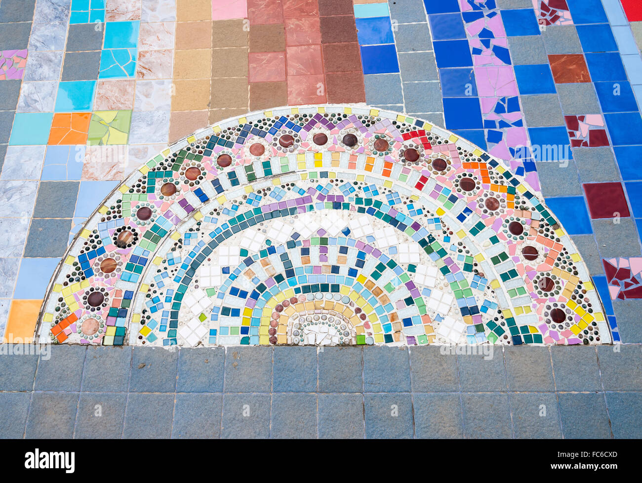 Half circle ceramic tile on the floor of theme park Stock Photo - Alamy