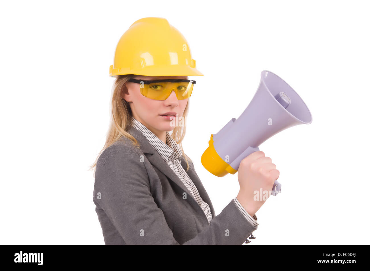 Female engineer in helmet with loudspeaker isolated on white Stock ...