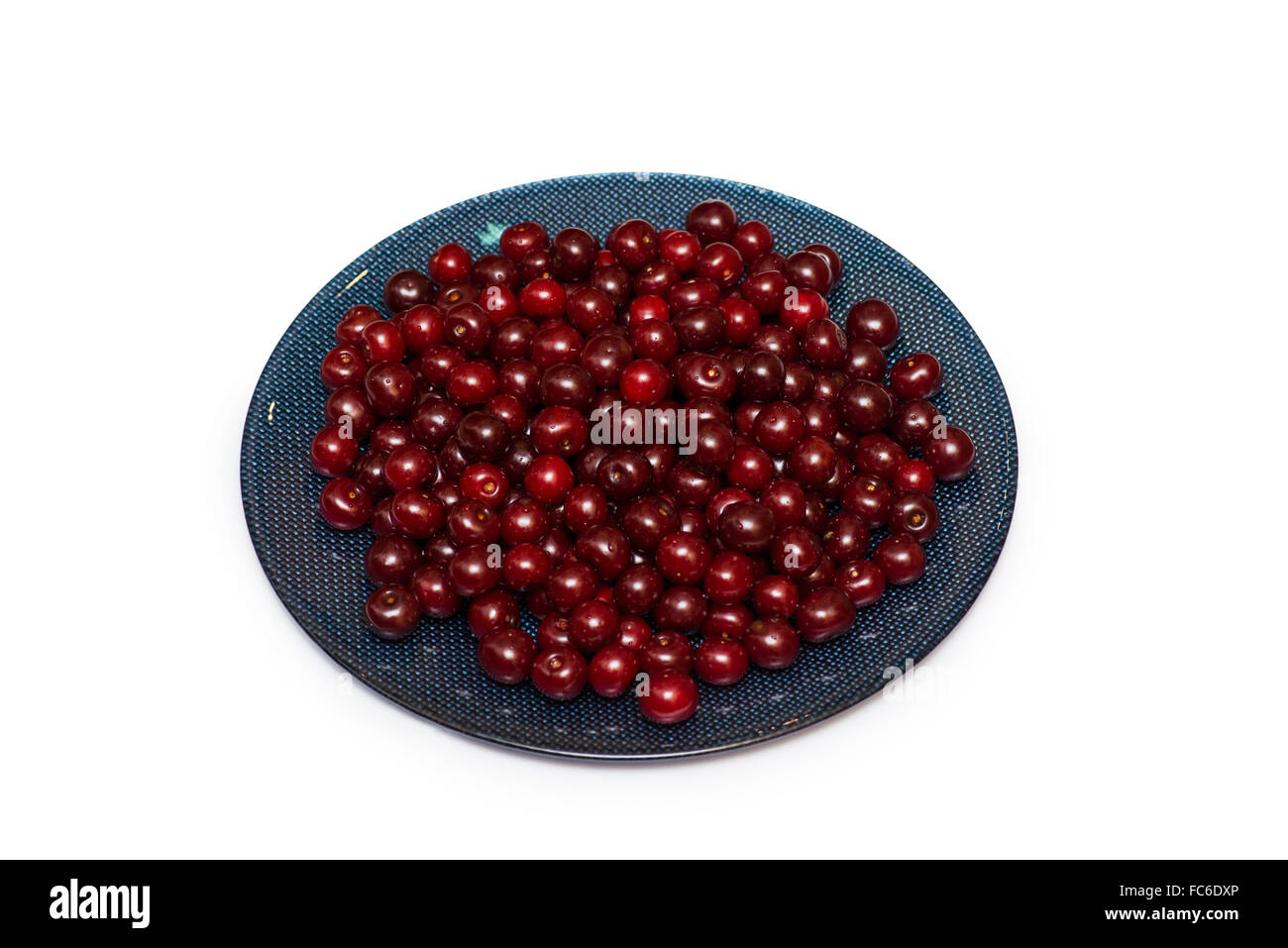 Plate full of cherries isolated on white Stock Photo - Alamy