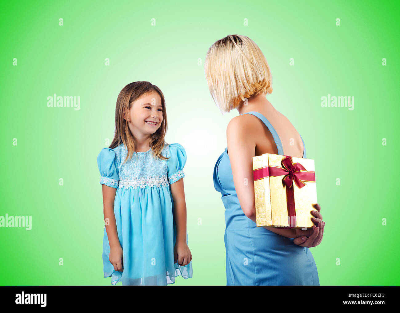 Happy mom and daughter on white Stock Photo - Alamy