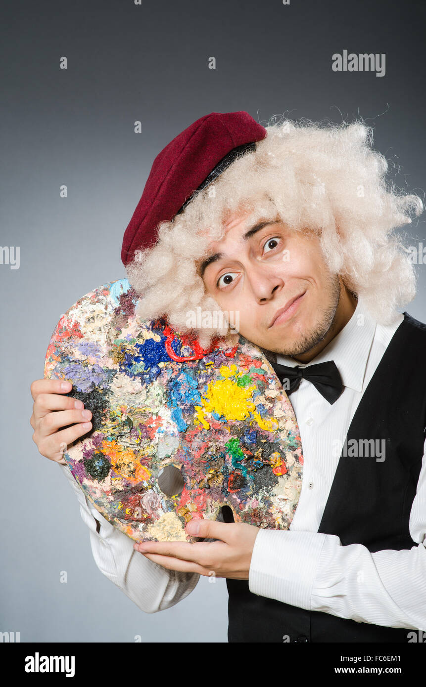 Funny artist in dark studio Stock Photo - Alamy