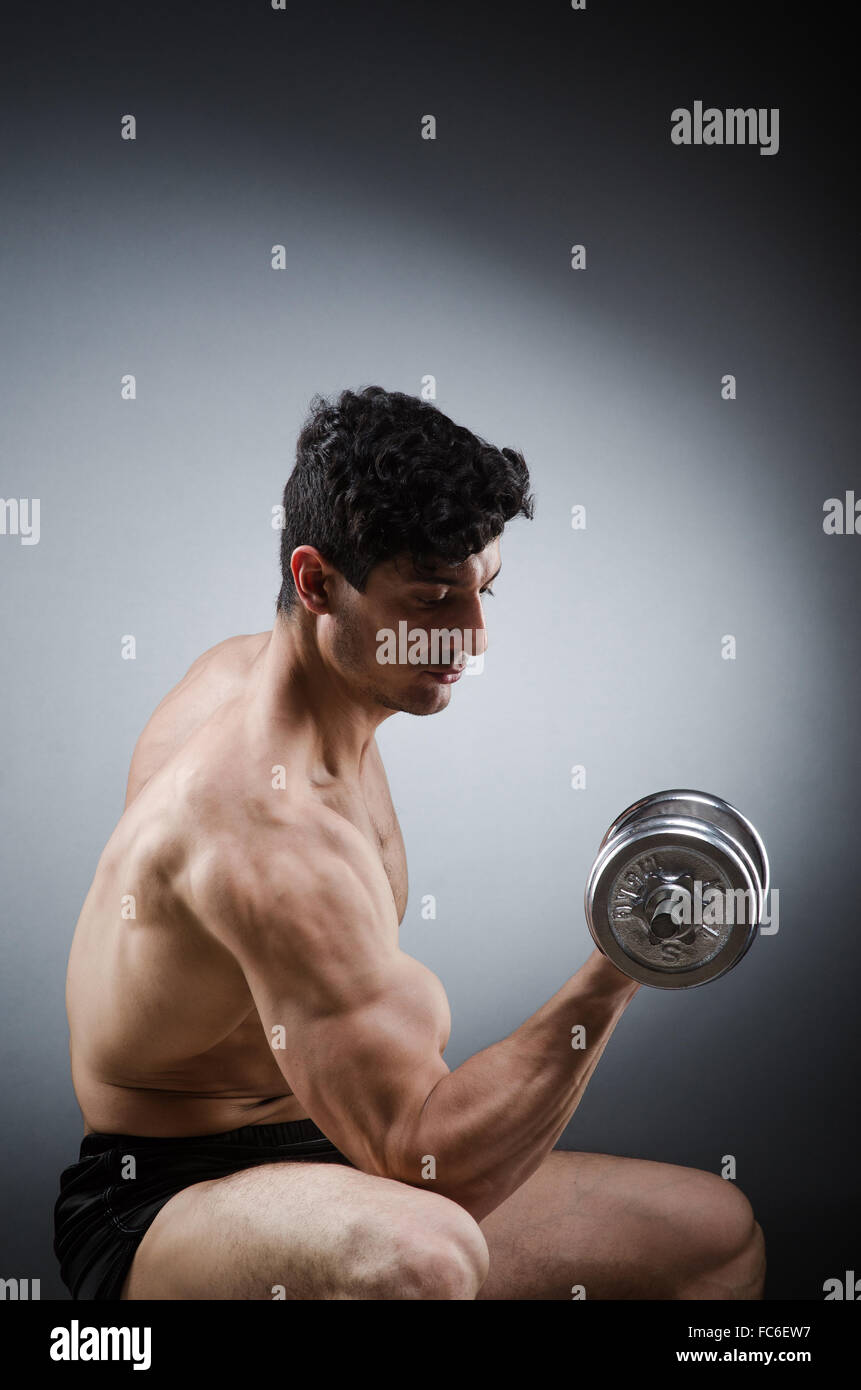 Muscular ripped bodybuilder with dumbbells Stock Photo - Alamy