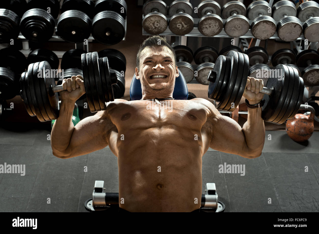 Muscle athletic guy bodybuilder dumbbells hi-res stock photography and ...