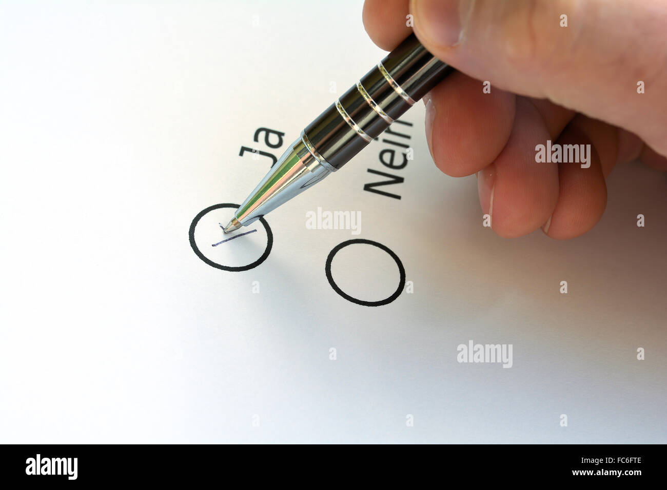 Vote on yes or no on a ballot Stock Photo - Alamy