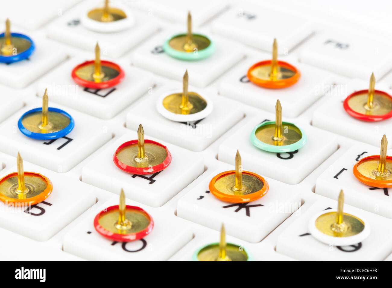 Pins on computer keyboard Stock Photo - Alamy