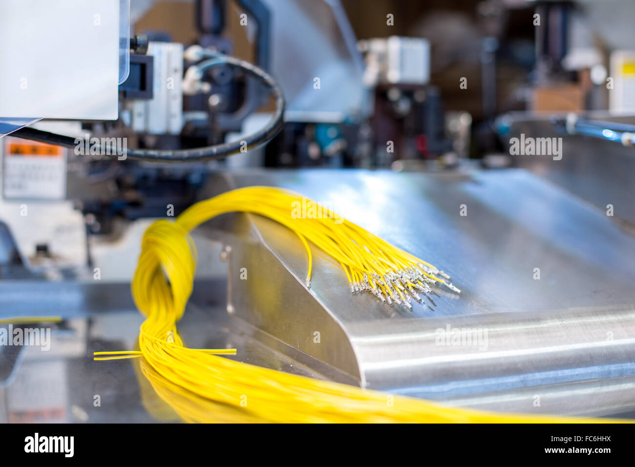 Bright crimped wires on machine, close-up Stock Photo - Alamy