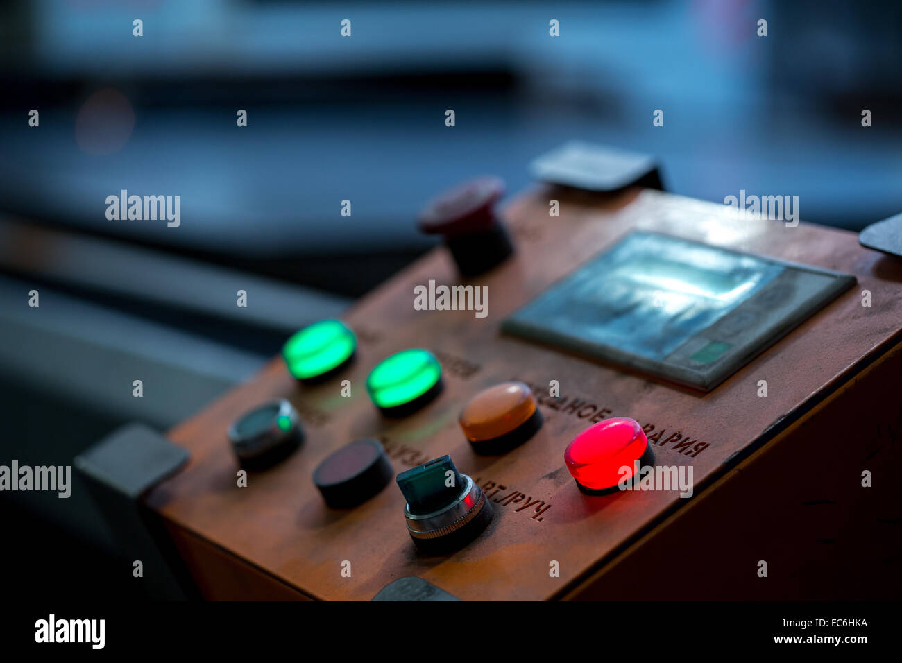 Close-up of red button lit on control panel Stock Photo - Alamy