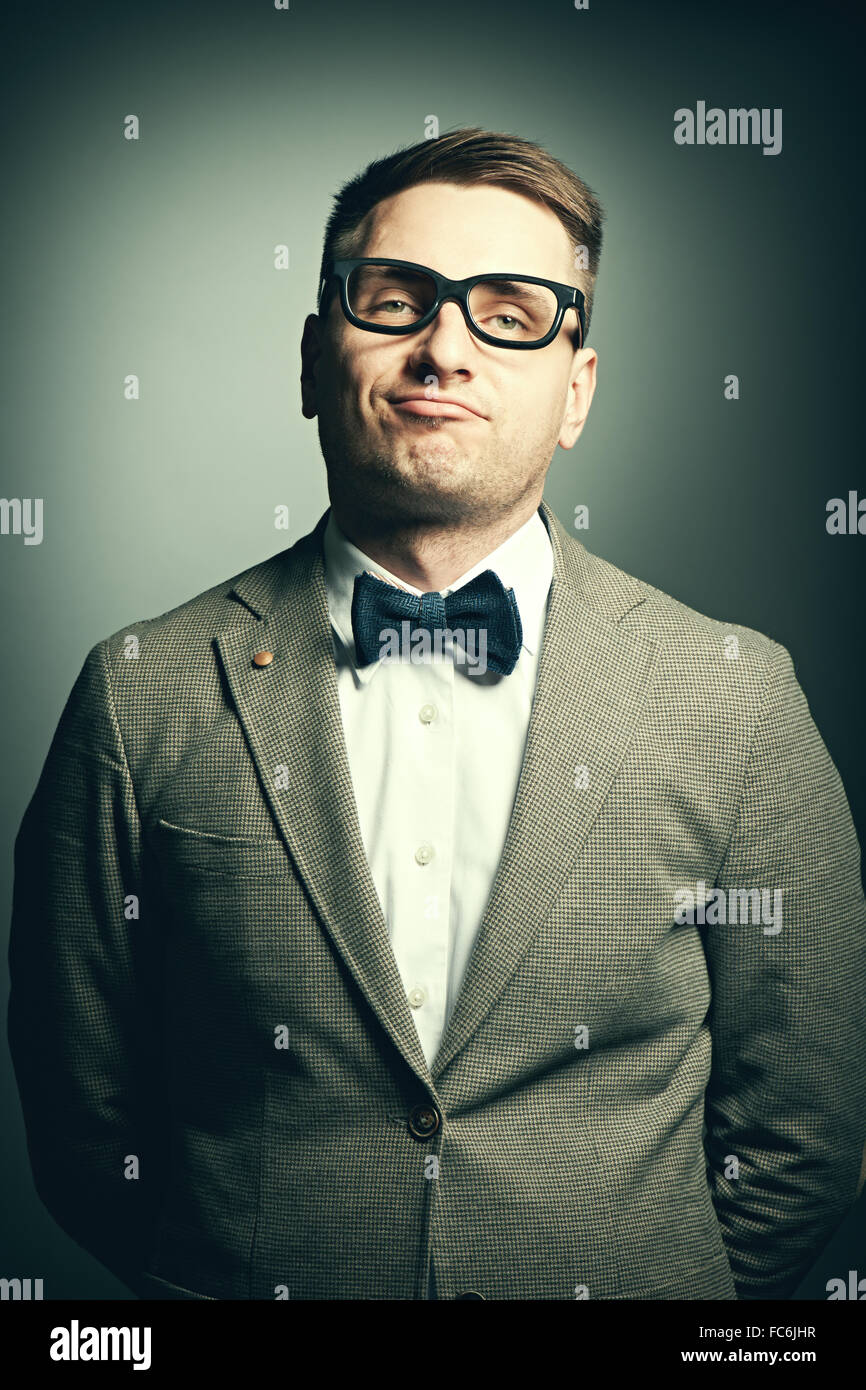 Confident nerd in eyeglasses and bow tie Stock Photo - Alamy