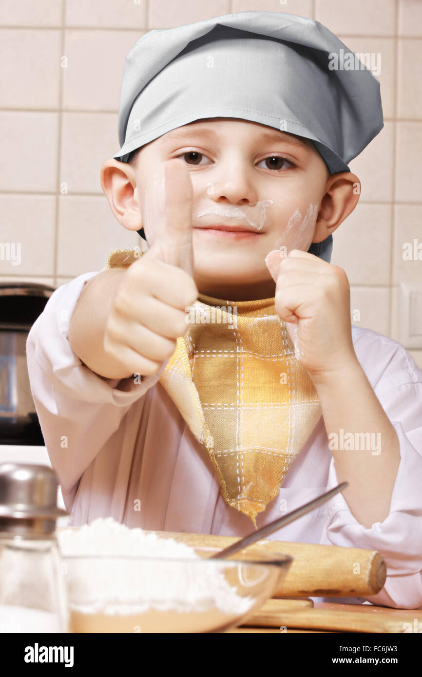 Contented little cook Stock Photo - Alamy